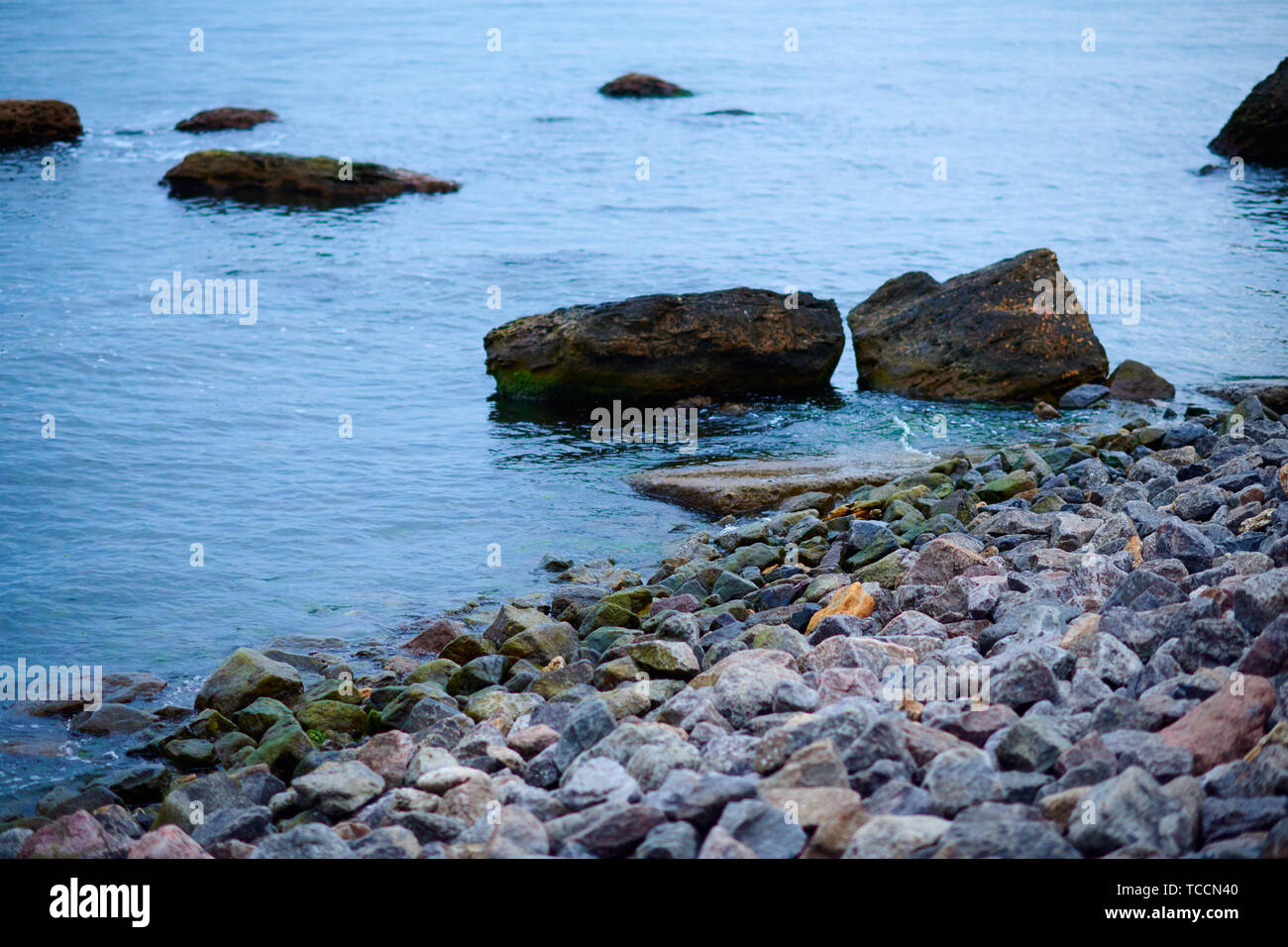 sea landscape at sunset, stone coast and beautiful sky Stock Photo - Alamy