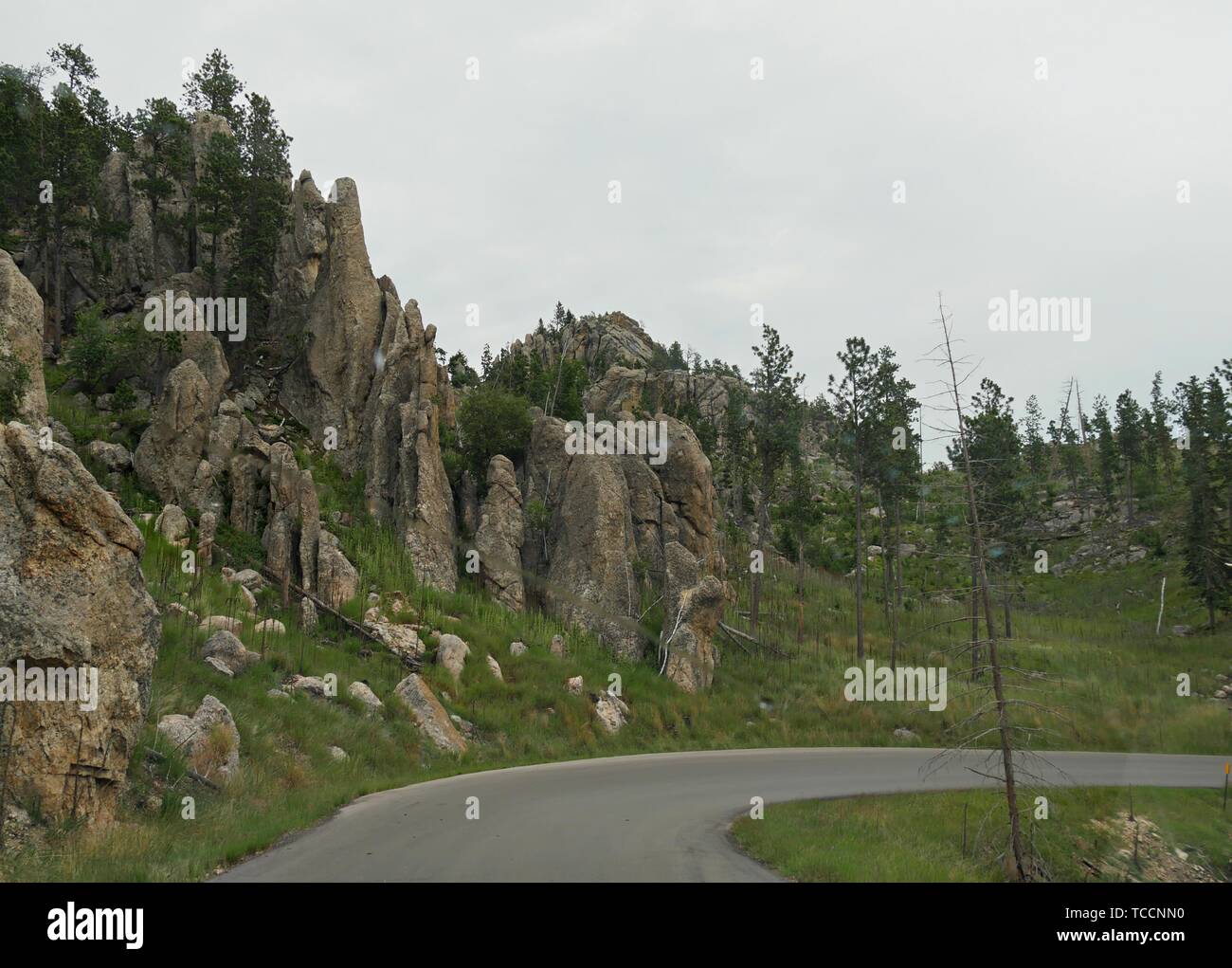 Dramatic twists in the road with rock formations and granite cliffs at ...