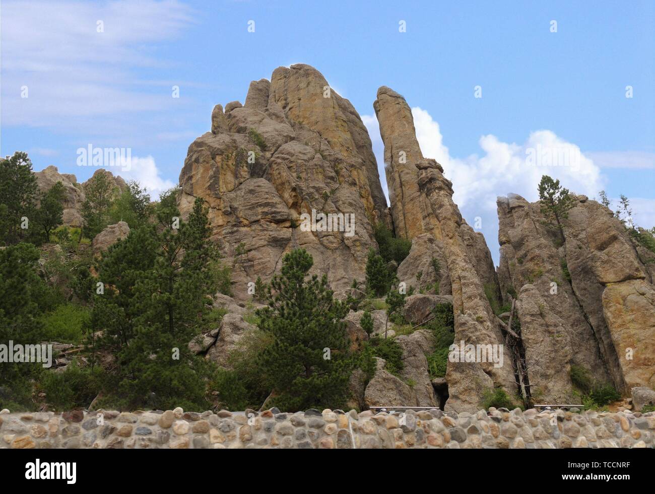 Dramatic shapes of granite cliffs and rock formations along Needles ...