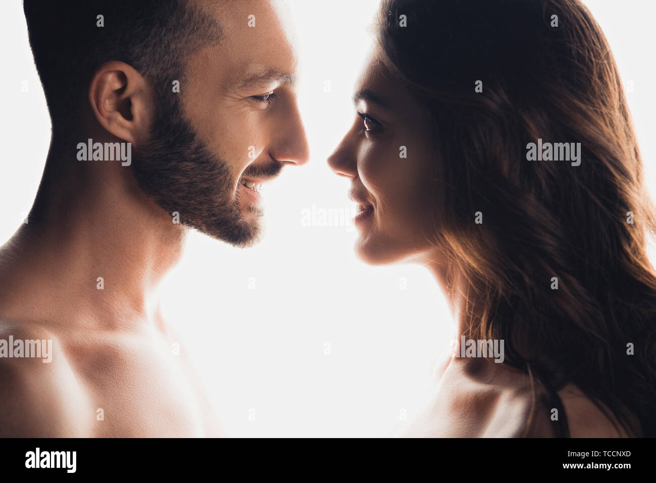 Side view of couple looking at each other isolated on white Stock Photo ...