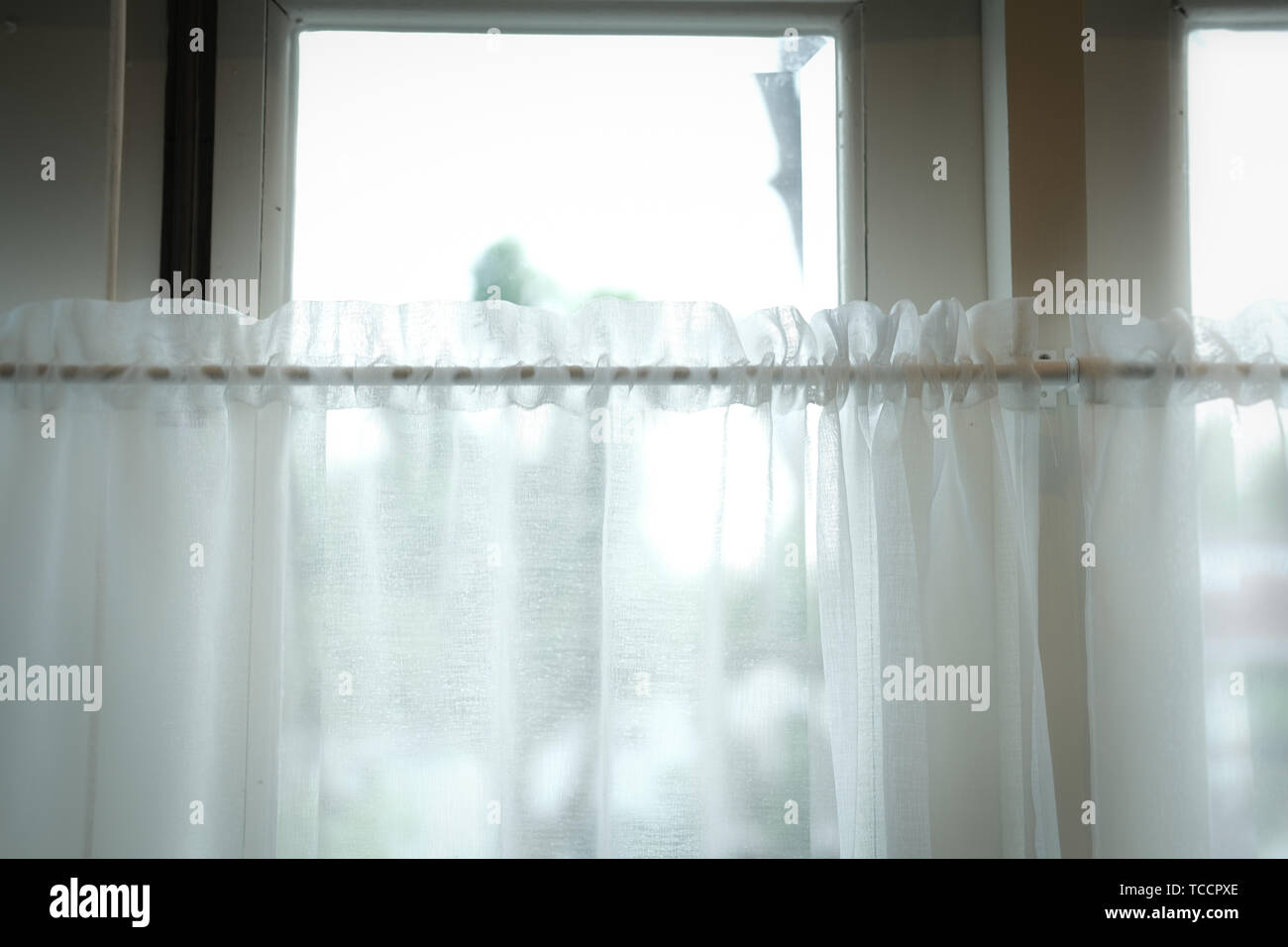 white see through window curtain in house home Stock Photo - Alamy