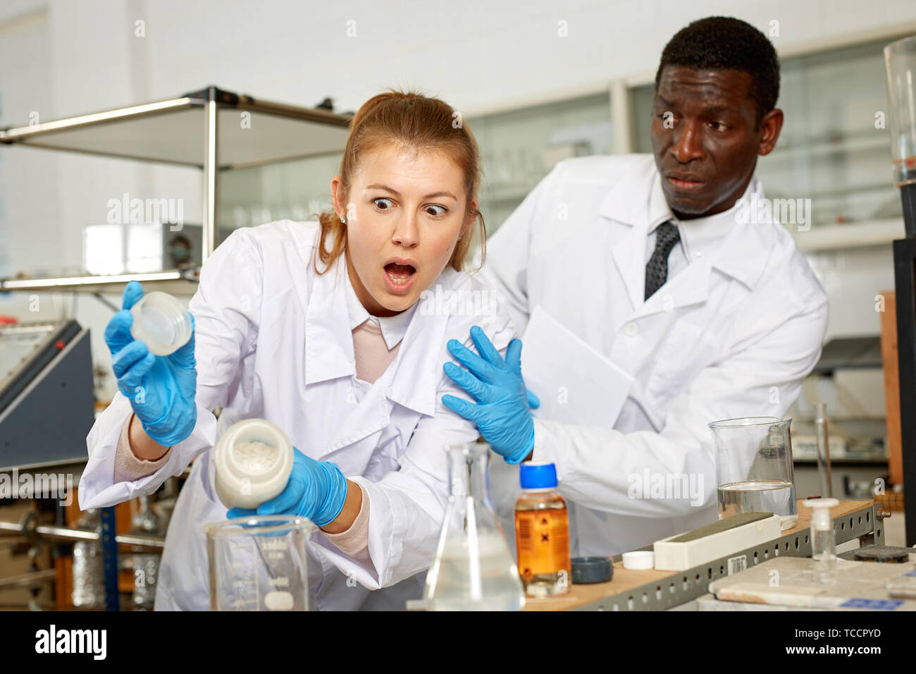 Worriend and scared male and female scientists after chemical ...