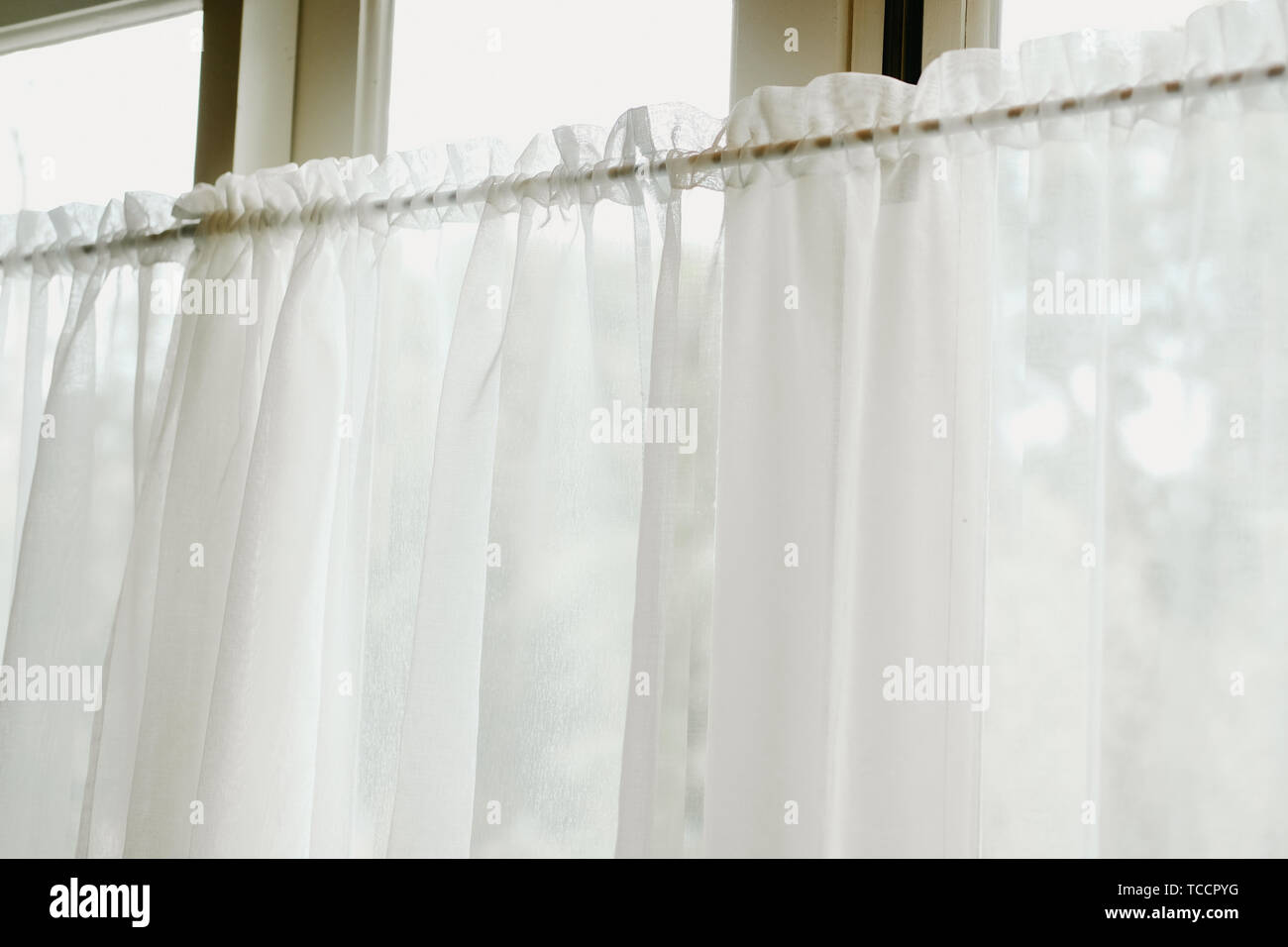 white see through window curtain in house home Stock Photo - Alamy