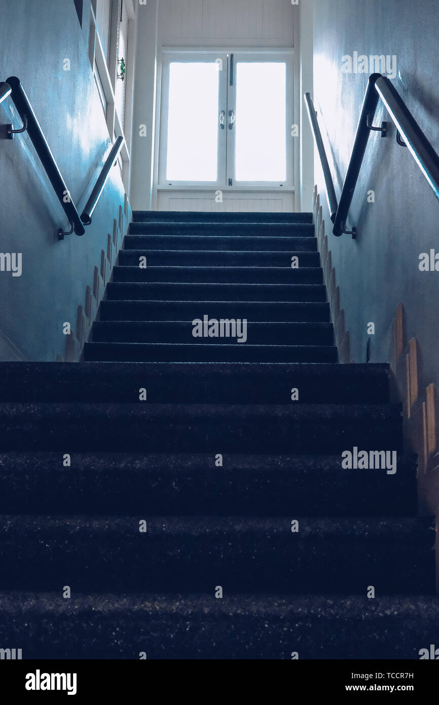stairs stairway staircase leading up to window light Stock Photo - Alamy