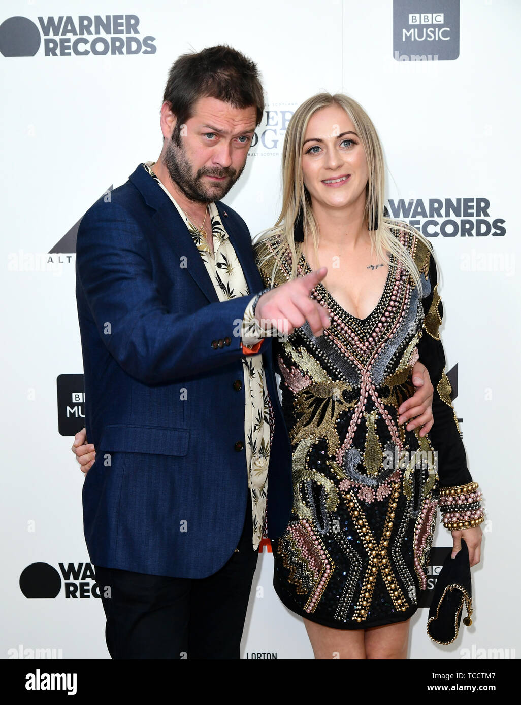 Tom Meighan and guest attending the As It Was Premiere at Alexandra ...