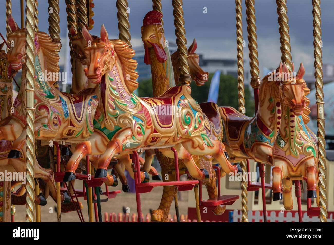 A traditional Fairground carousel with painted horses Stock Photo - Alamy