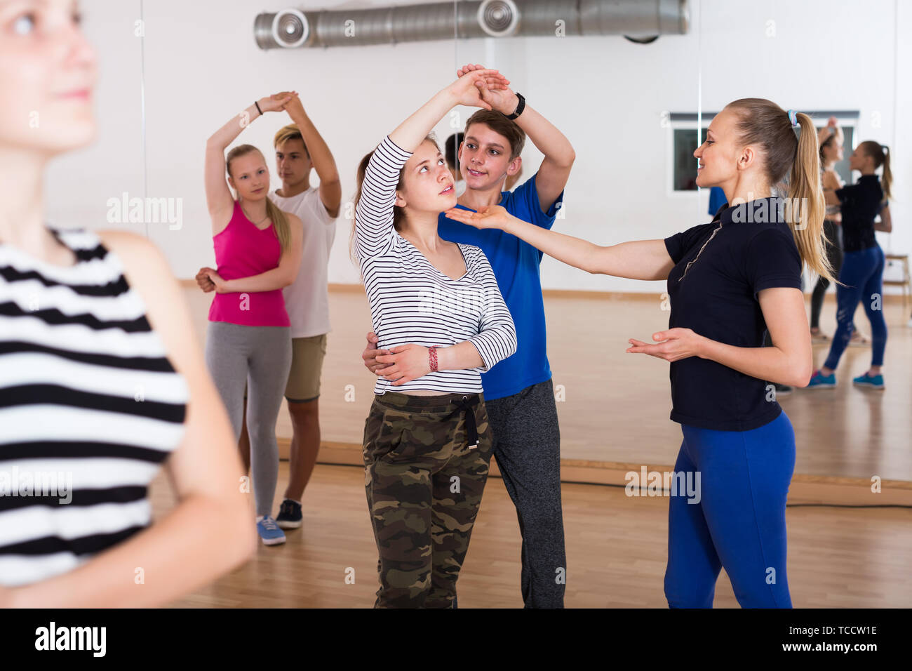 female choreographer teaches children to dance in the hall Stock Photo ...