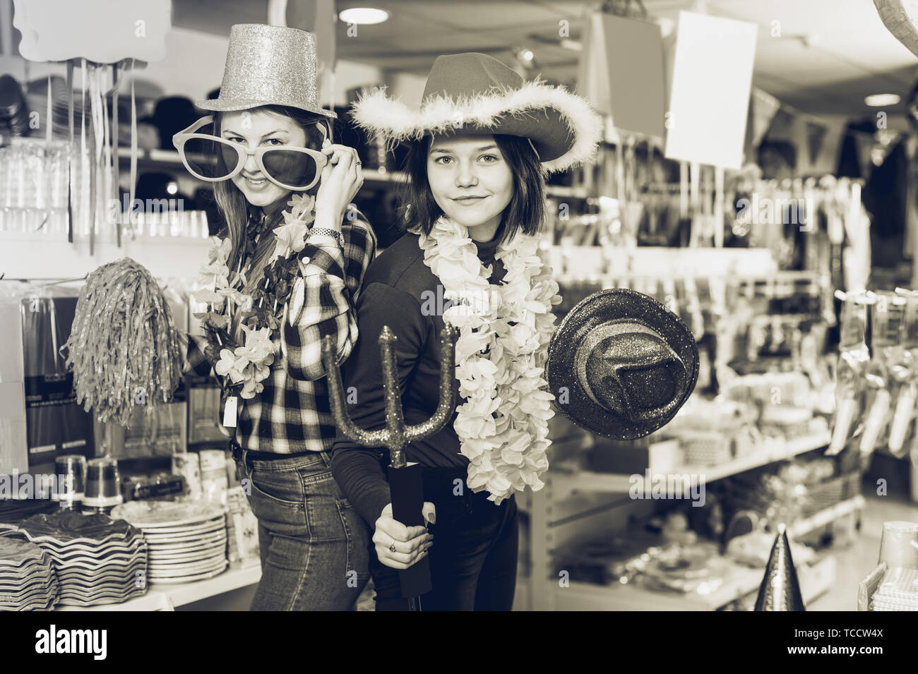 Positive girls shopping together, show funny things in store of ...