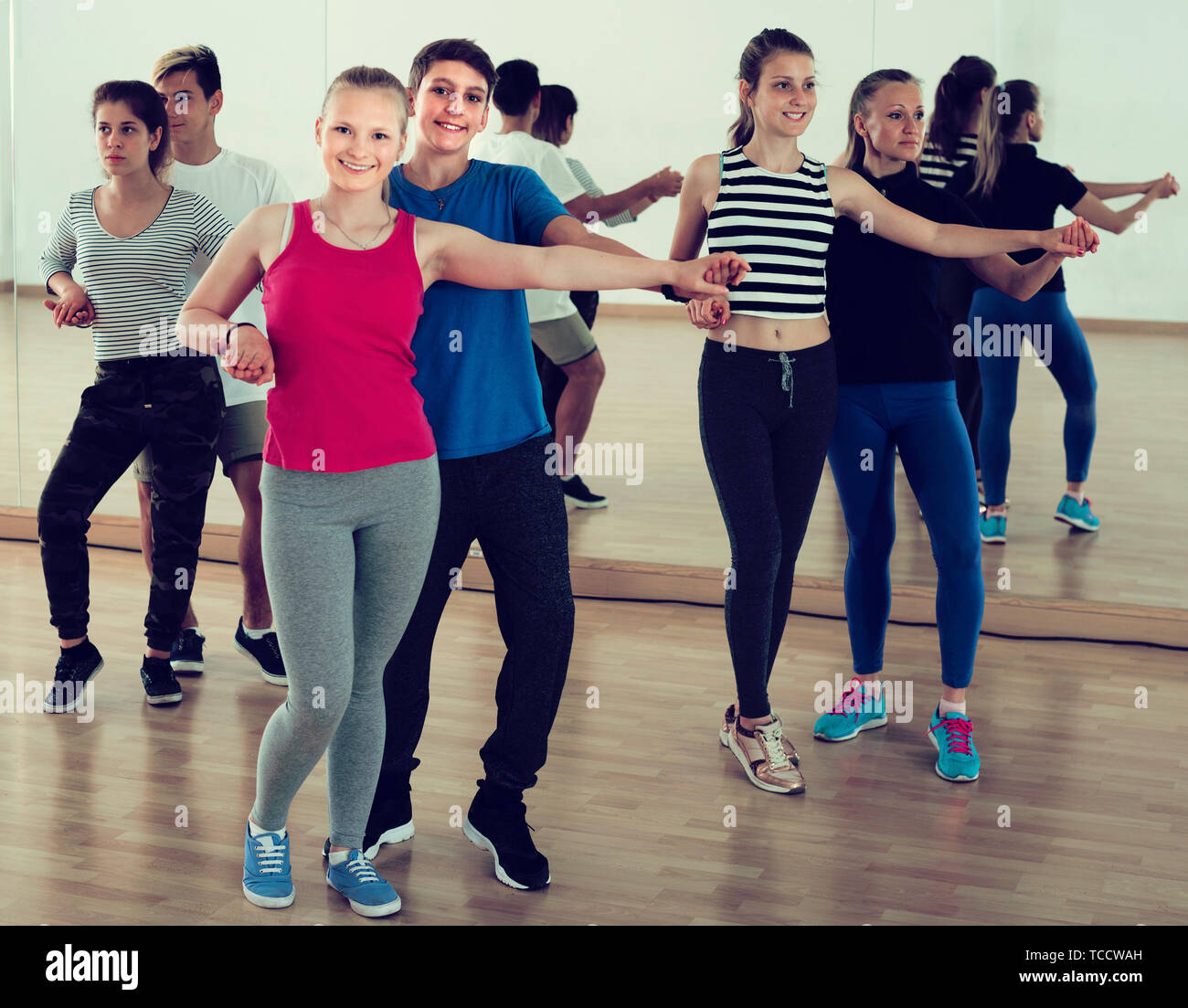 Portrait of teenagers dancing of partner dance at dance school Stock ...