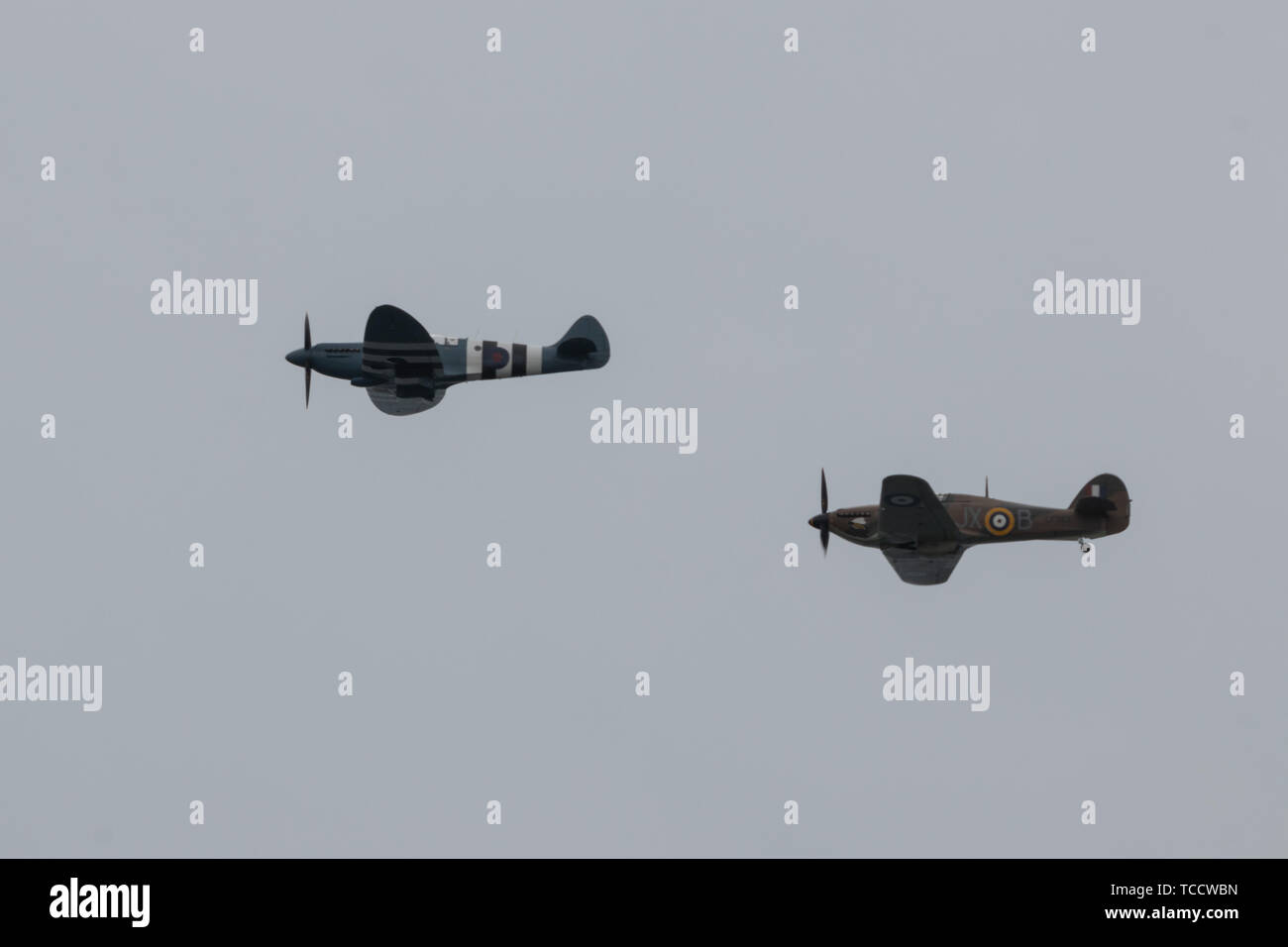 Two World War Two Planes In Flight Spitfire Plane And A Hurricane Plane two-world-war-two-planes-in-flight-spitfire-plane-and-a-hurricane-plane