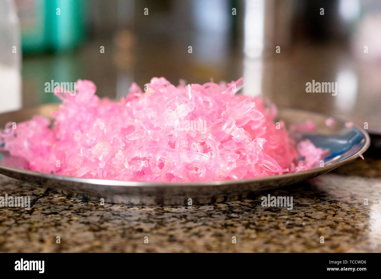 Female grating pink soap for putting into homemade soap Stock Photo - Alamy