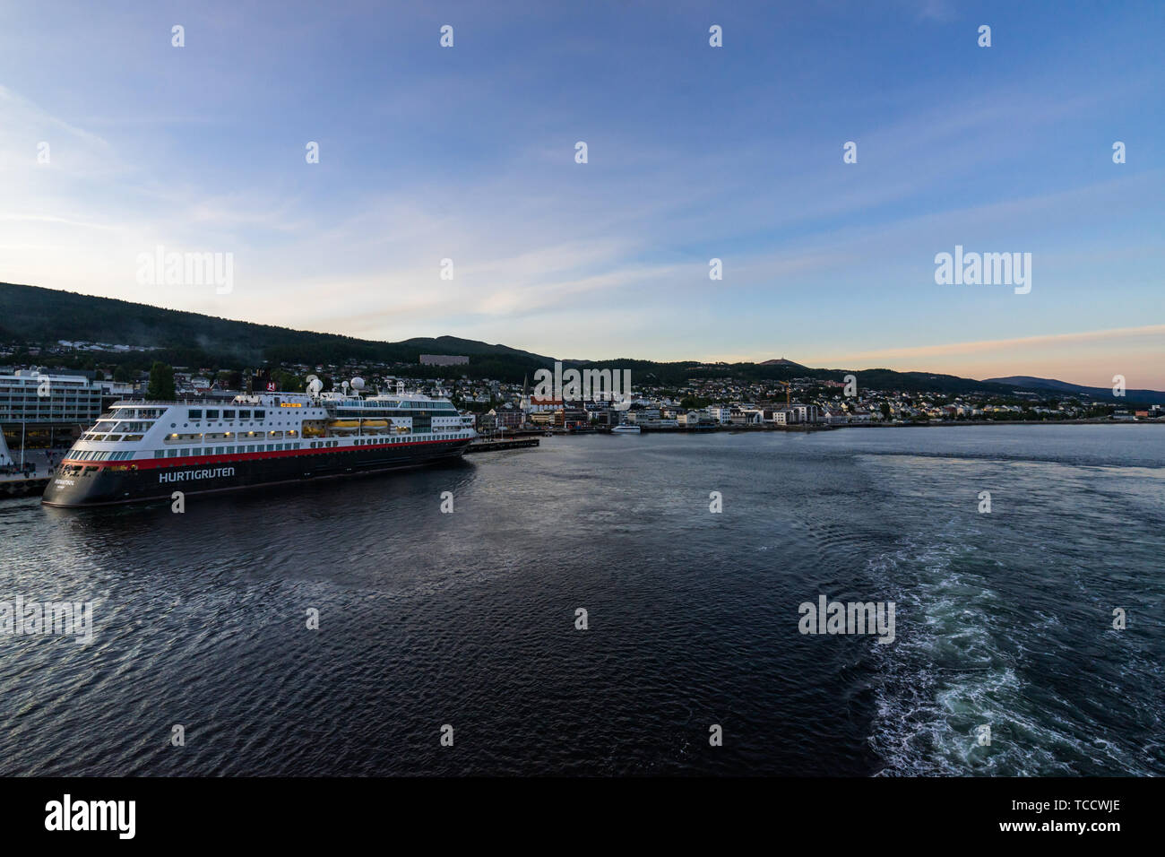 Hurtigruten cruise ship moored at Molde port in late afternoon. Molde ...