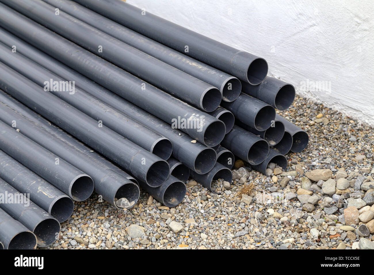 Plastic pipes lie on the construction site Stock Photo - Alamy