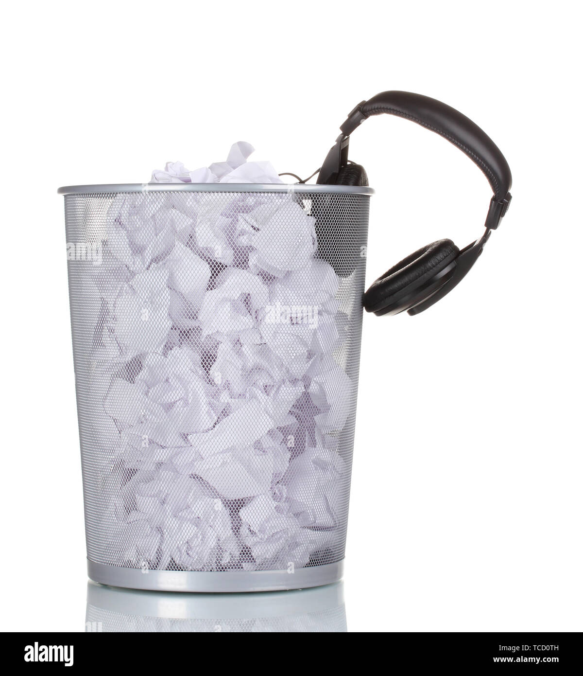 headphones and paper in metal trash bin isolated on white Stock Photo ...