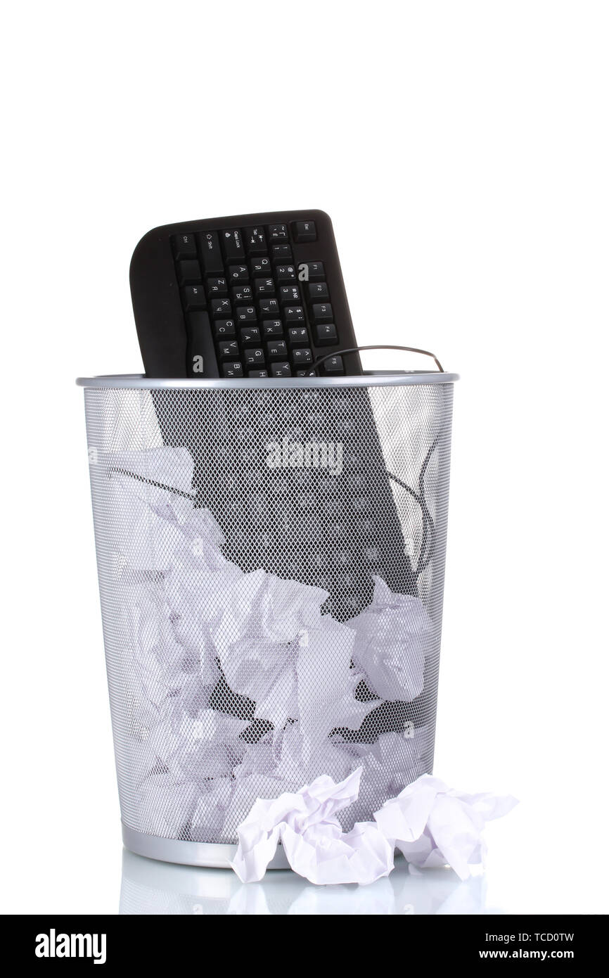 Old PC keyboard and paper in metal trash bin isolated on white Stock ...