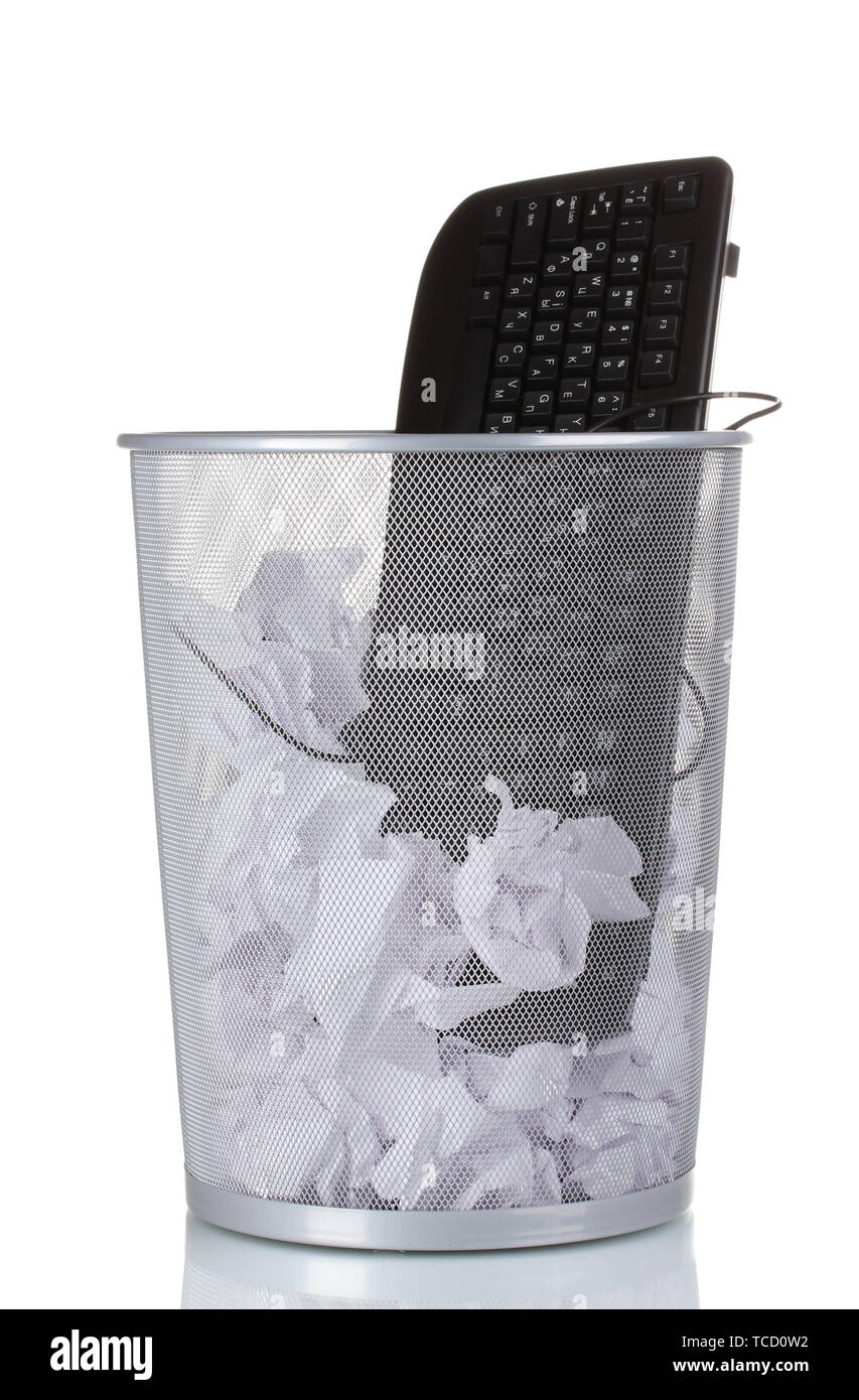 Old PC keyboard and paper in metal trash bin isolated on white Stock ...