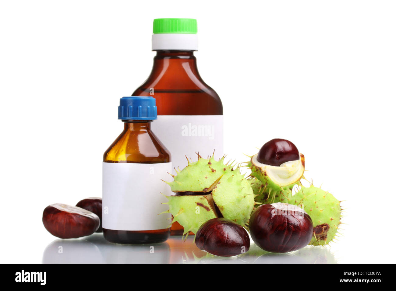green and brown chestnuts and medical bottles isolated on white Stock ...