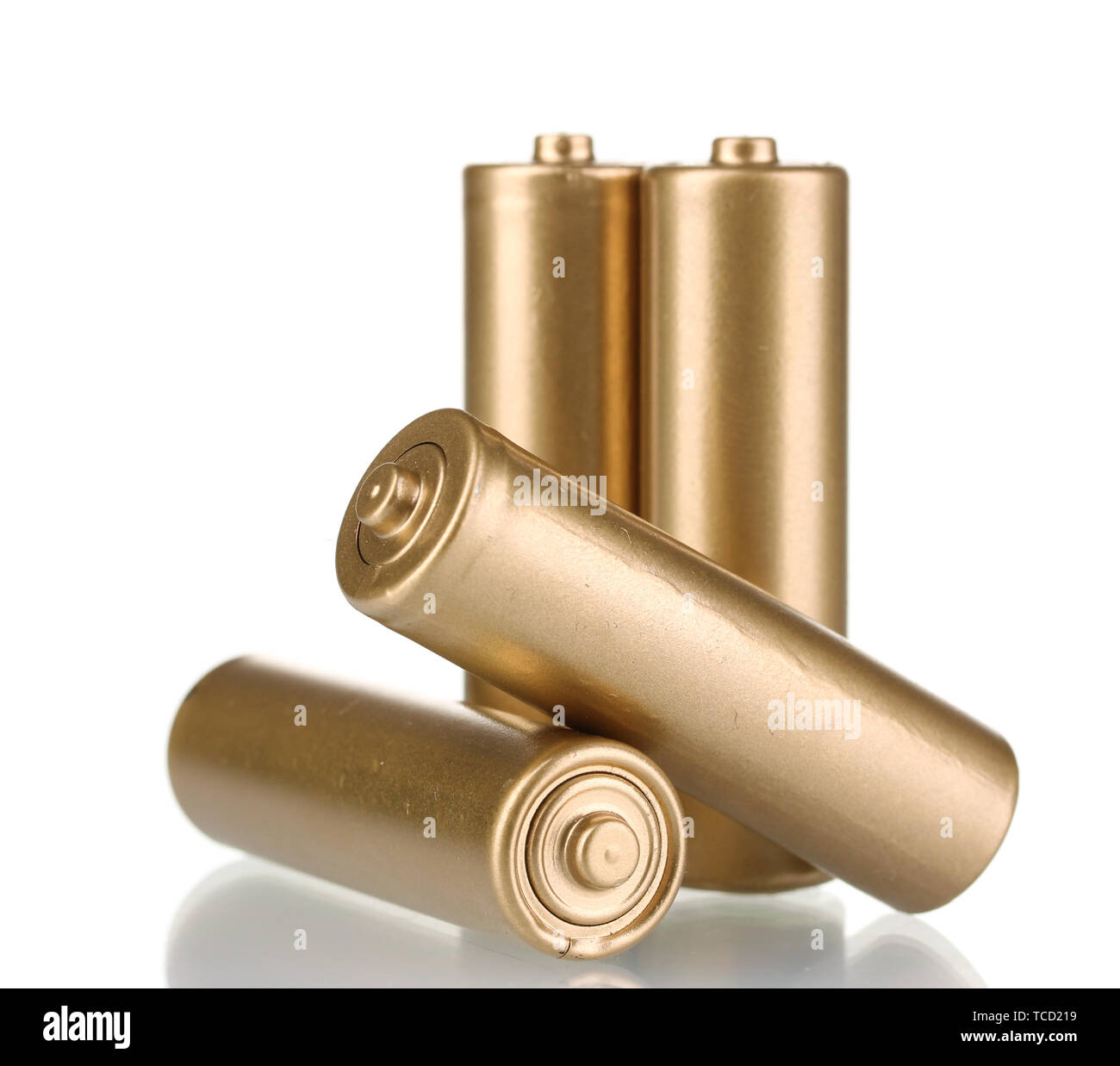 four golden batteries isolated on white Stock Photo - Alamy
