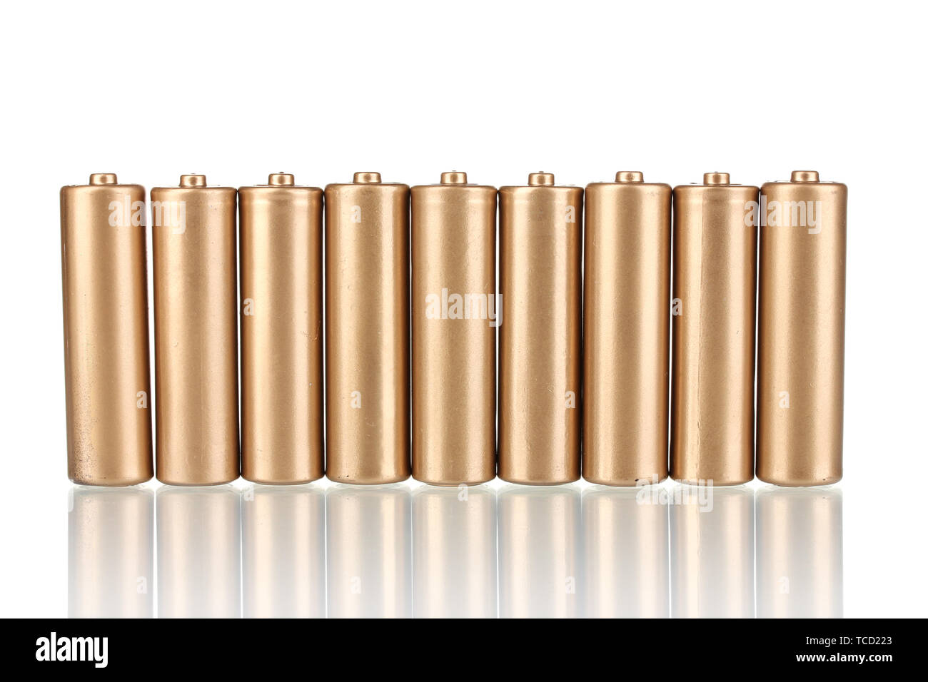 golden batteries isolated on white Stock Photo - Alamy