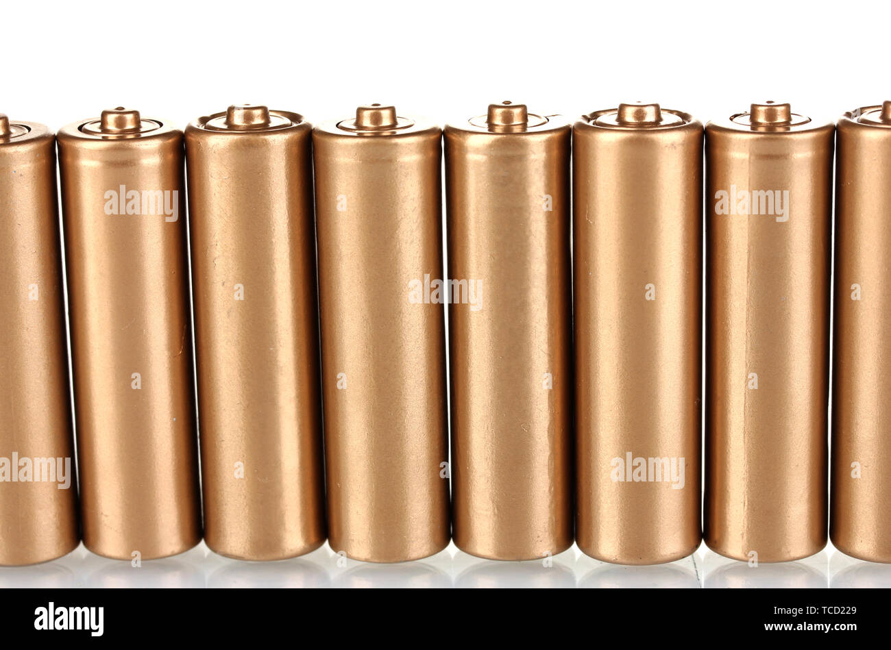 golden batteries isolated on white Stock Photo - Alamy