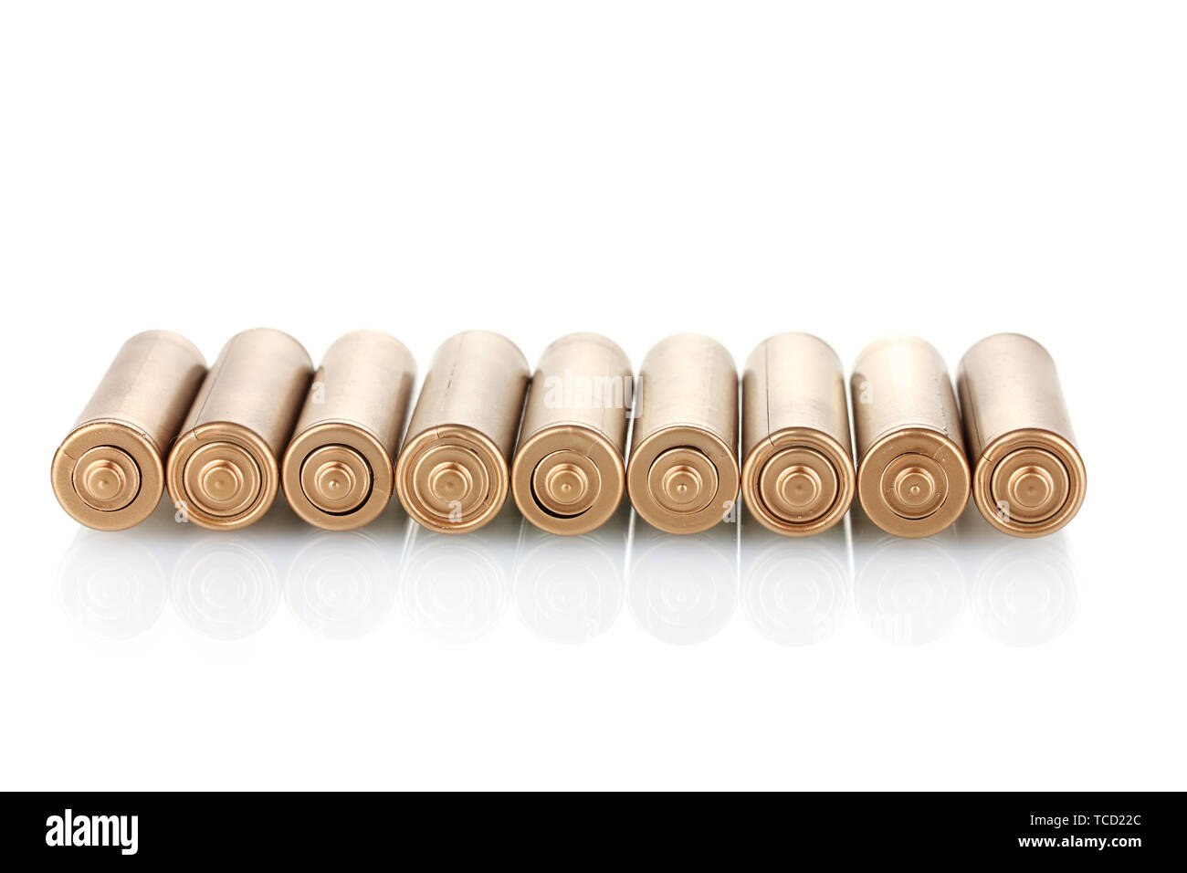 golden batteries isolated on white Stock Photo - Alamy
