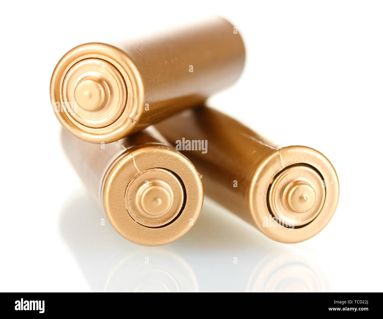 three golden batteries isolated on white Stock Photo - Alamy