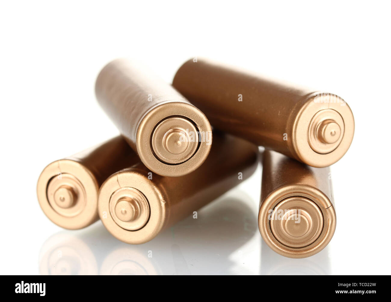 golden batteries isolated on white Stock Photo - Alamy