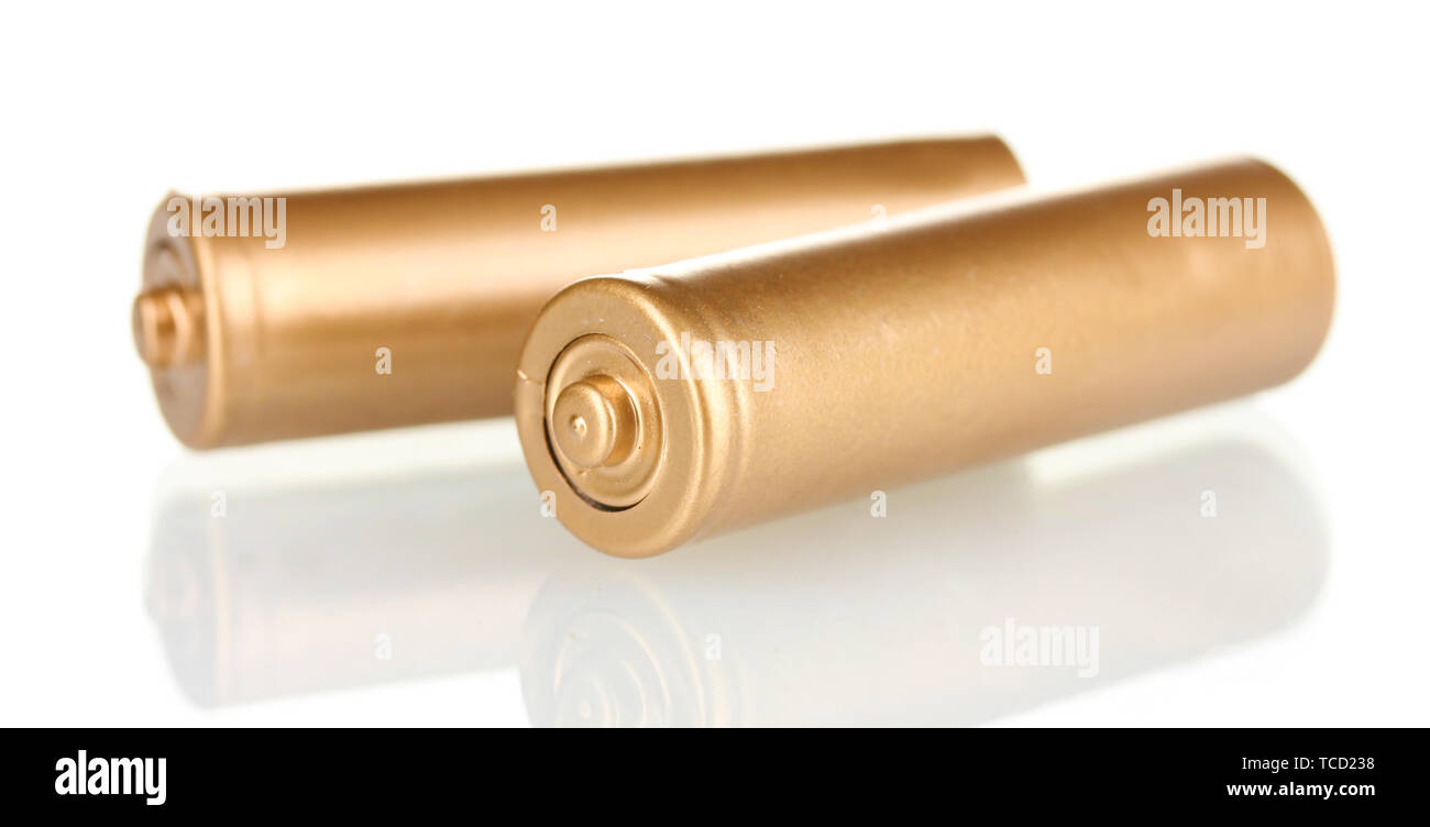 two golden batteries isolated on white Stock Photo - Alamy