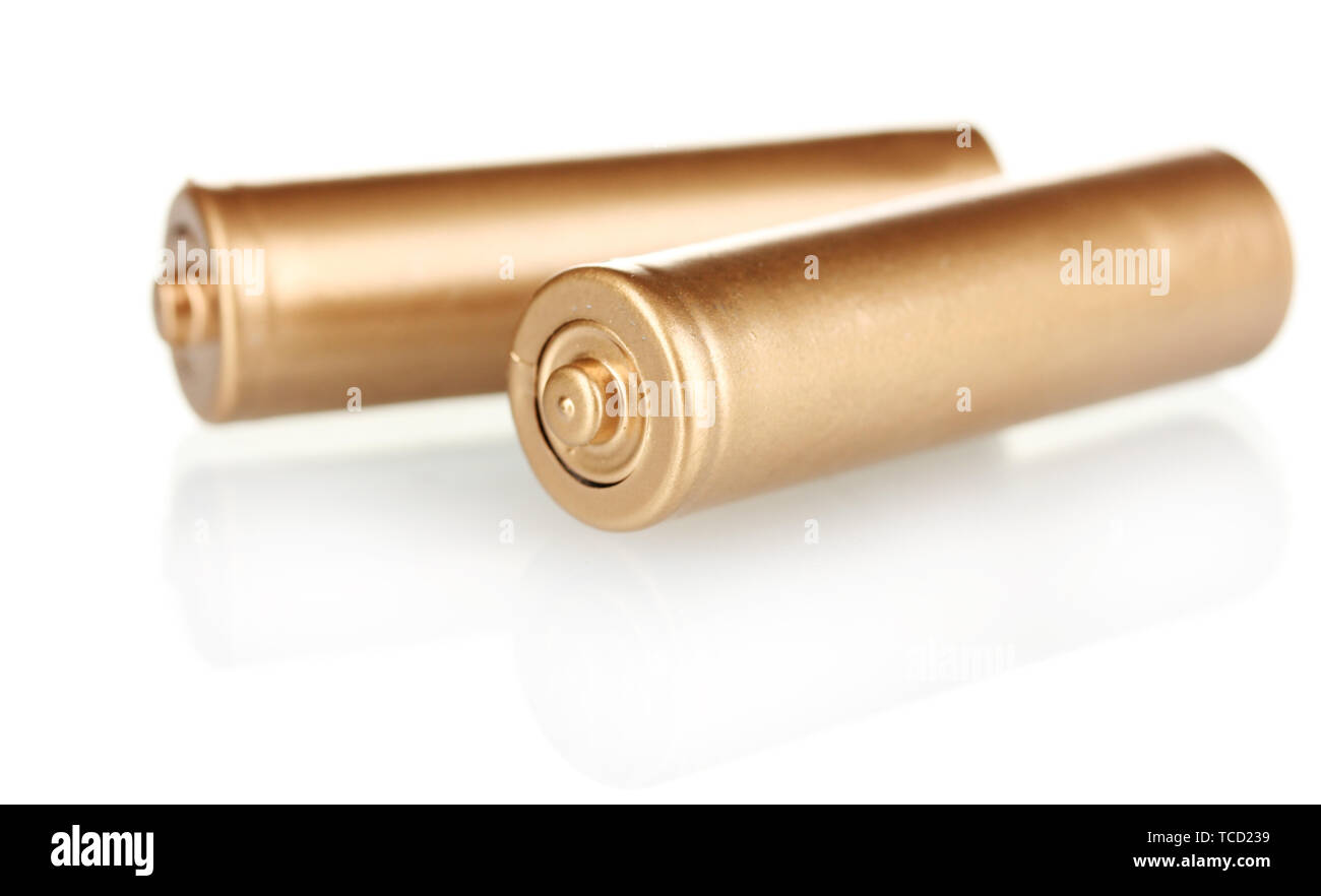 two golden batteries isolated on white Stock Photo - Alamy