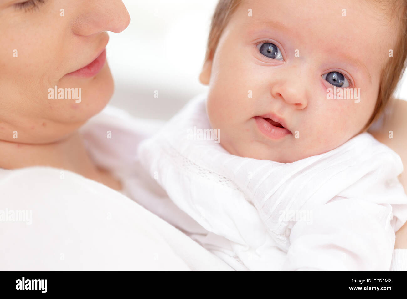Woman rocking chair holding baby hi-res stock photography and images ...