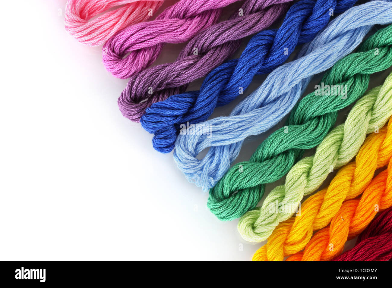 sewing threads for embroidery isolated on white Stock Photo - Alamy