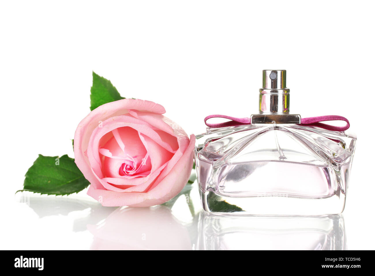 Perfume bottle and pink rose isolated on white Stock Photo - Alamy