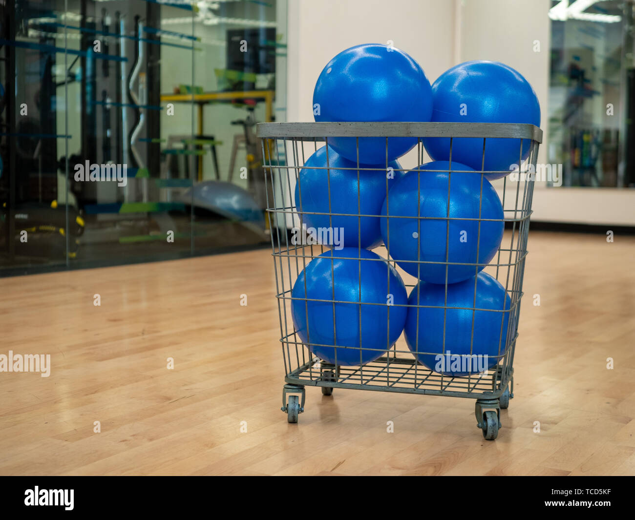 Basket with blue core exercise balls in an exercise studio Stock Photo ...