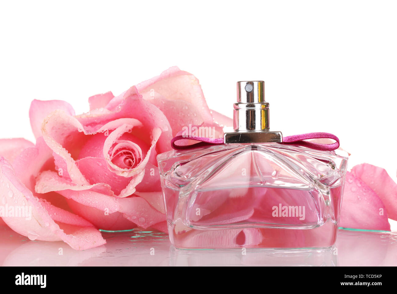 Perfume bottle and pink rose isolated on white Stock Photo - Alamy