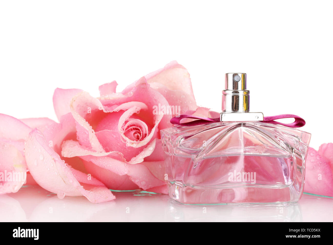 Perfume bottle and pink rose isolated on white Stock Photo - Alamy