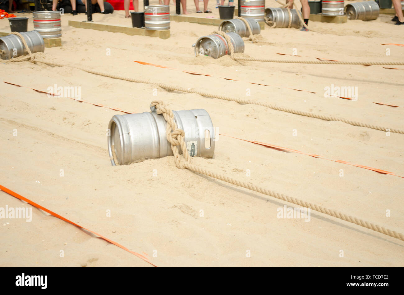 Sports competition with a barrel and a rope on the beach Stock Photo ...