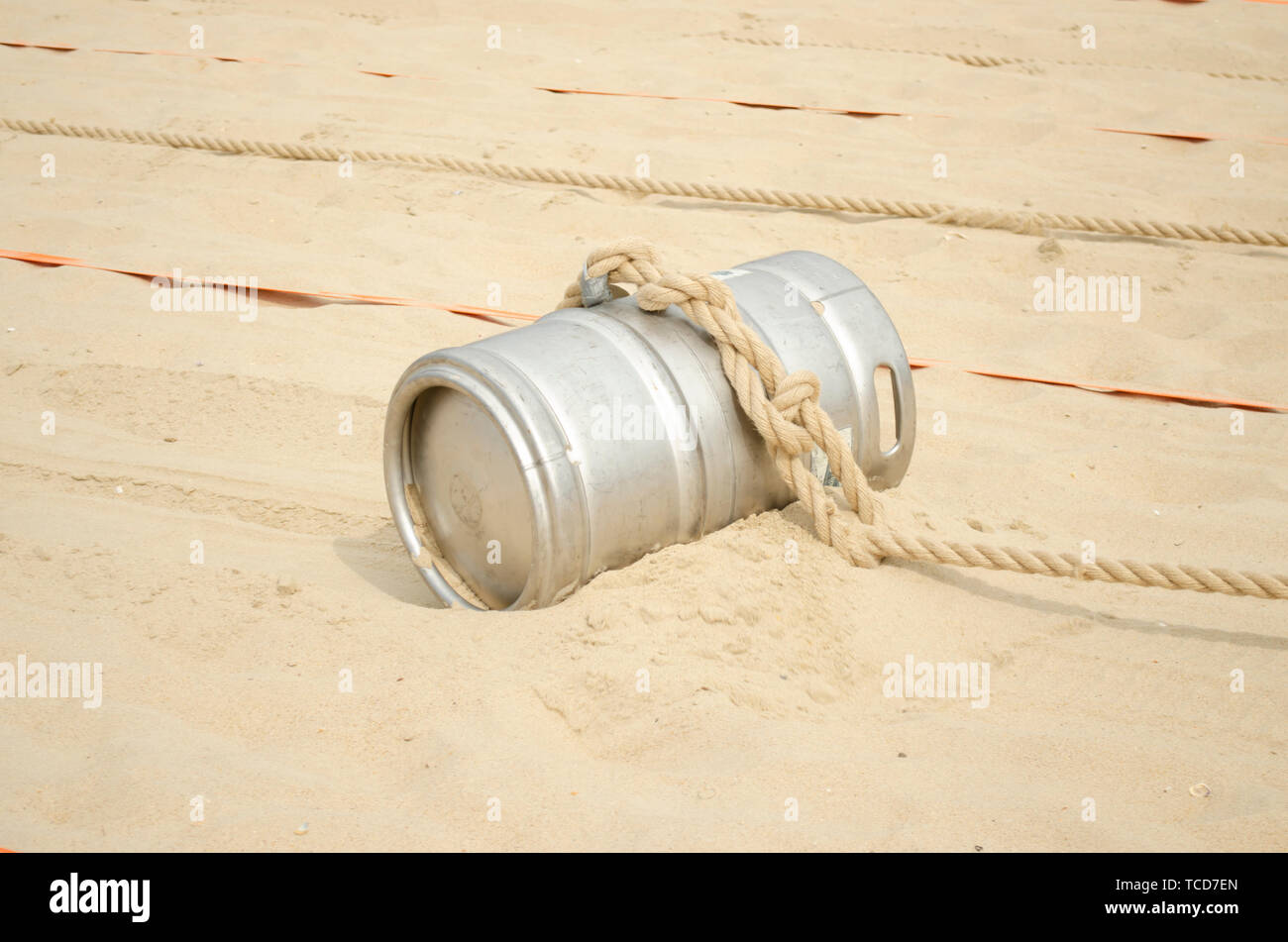 Sports competition with a barrel and a rope on the beach Stock Photo ...