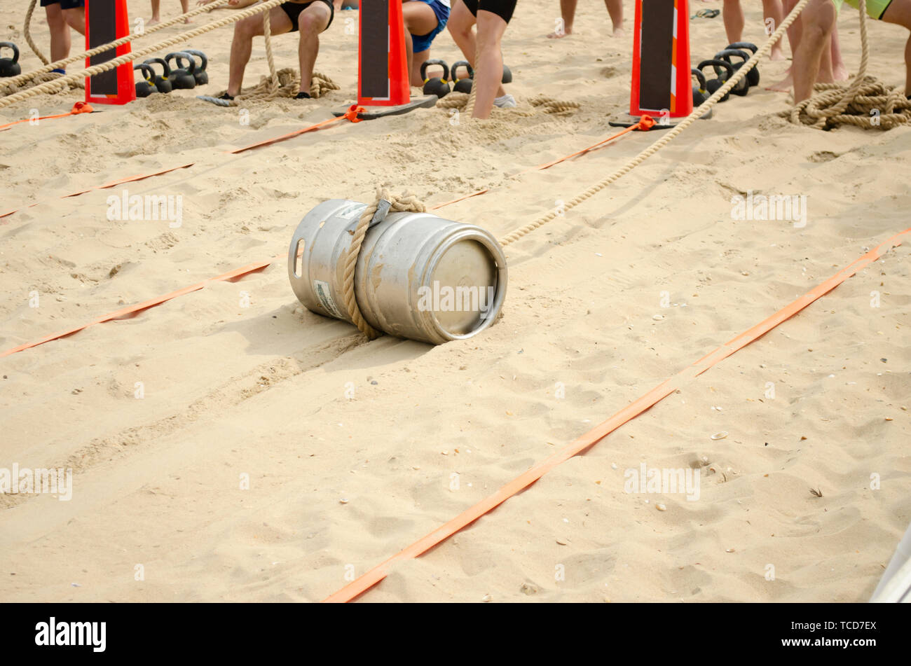 Sports competition with a barrel and a rope on the beach Stock Photo ...