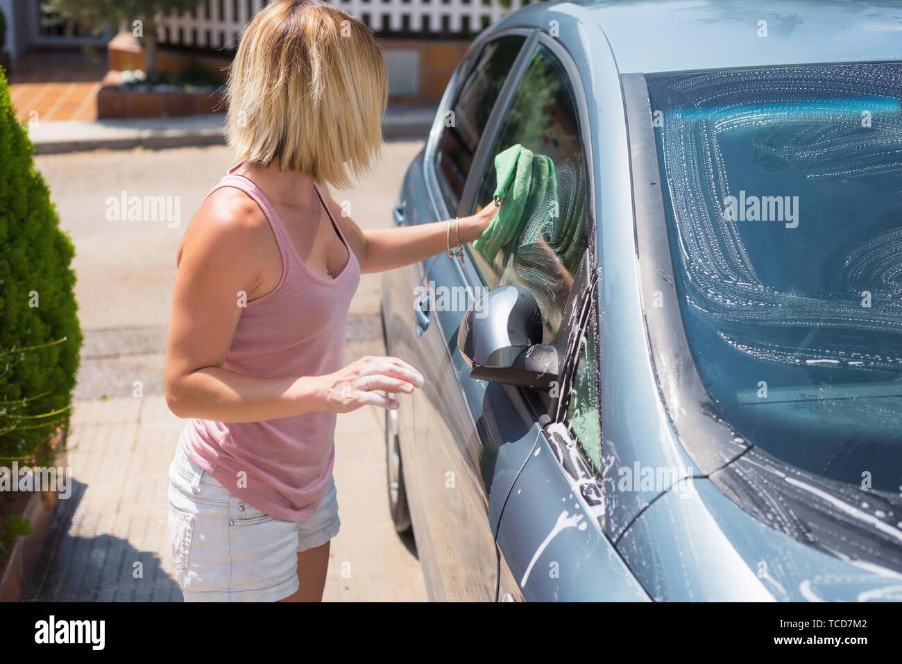 Woman Cleaning Window Car High Resolution Stock Photography and Images ...