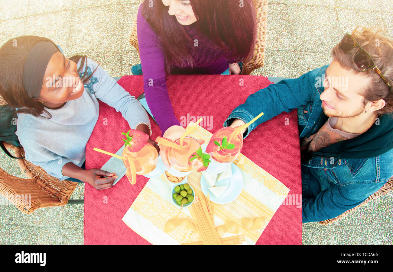 Three friends toast with cocktails celebrating friendship Stock Photo ...