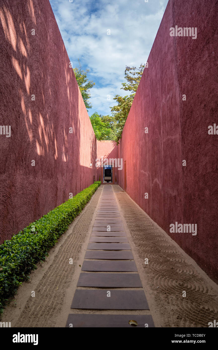 beautiful red unique walkway wall with abstract texture all around ...