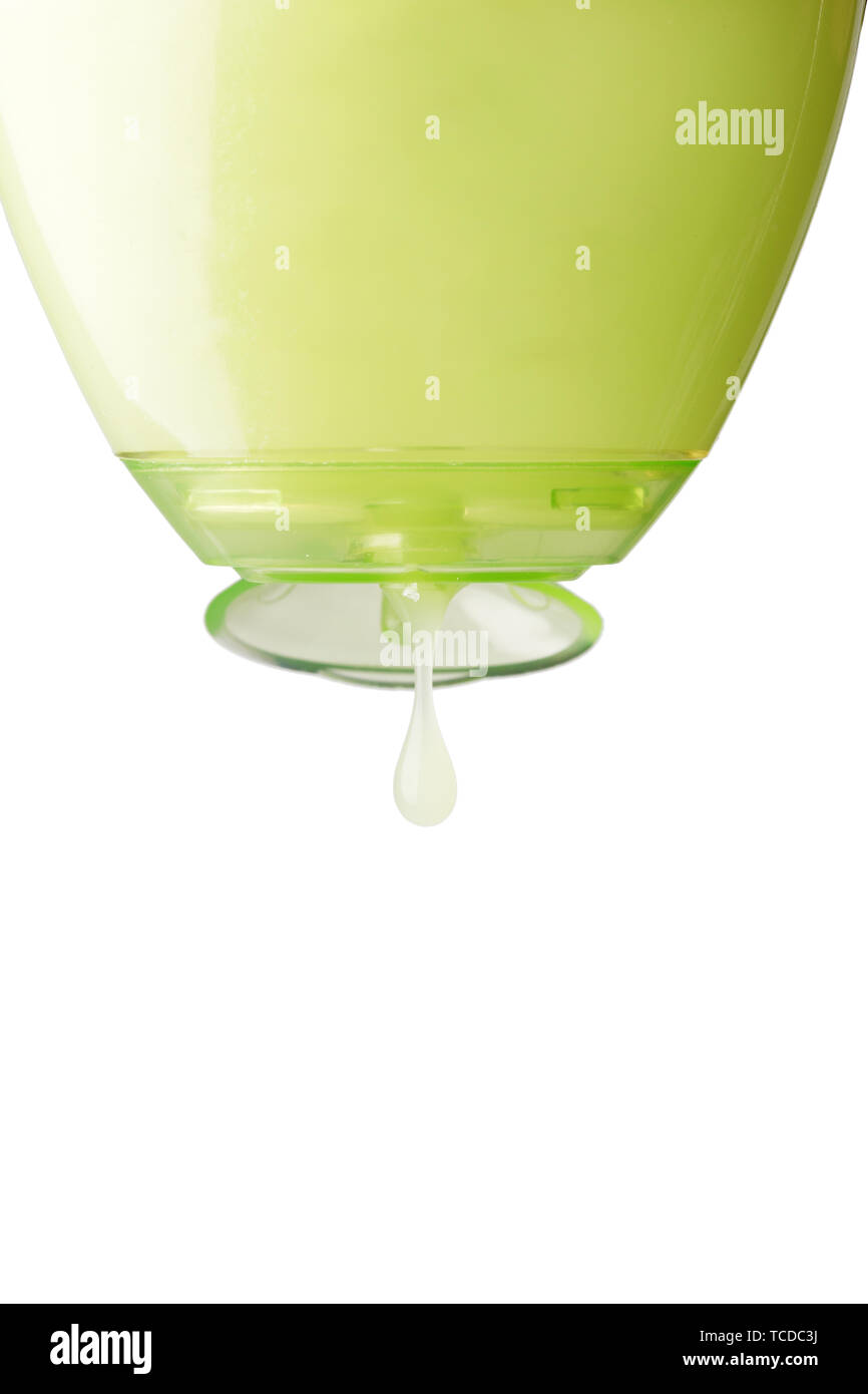 Cosmetic liquid pouring from bottle isolated on white background Stock ...