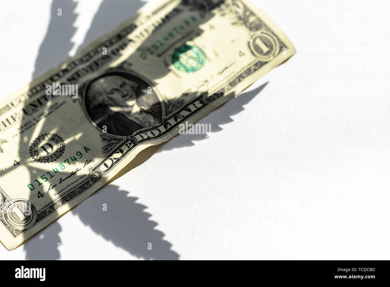 cannabis leaf and money Stock Photo - Alamy