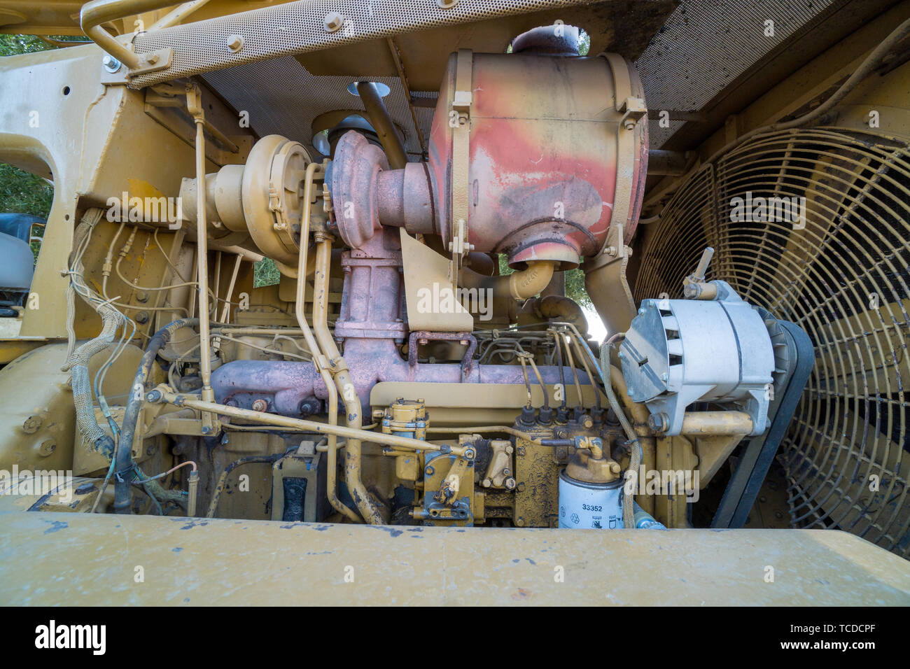 Yellow tractor heavy equipment diesel engine Stock Photo - Alamy
