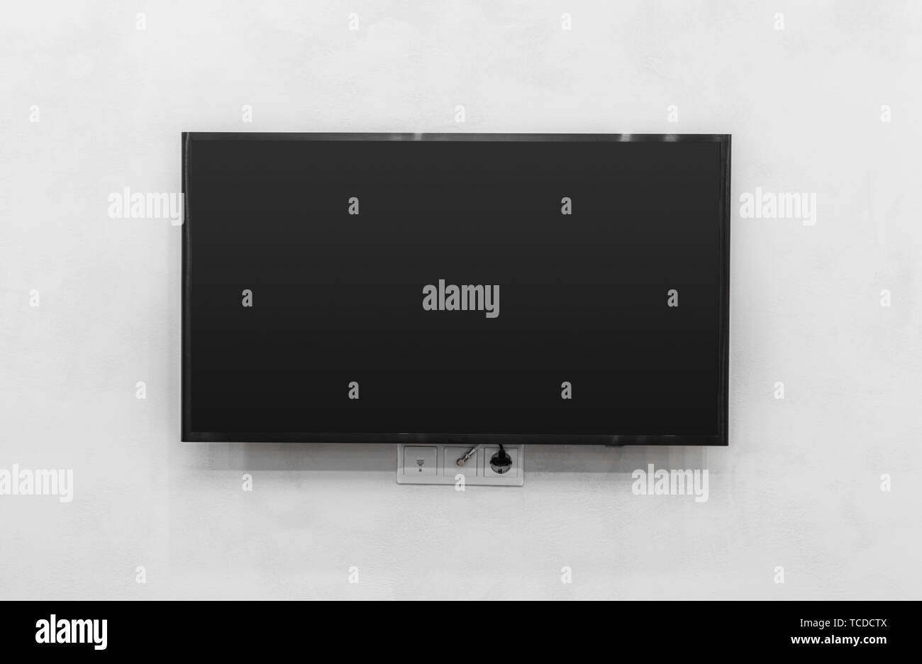 Led tv on the wall background Stock Photo - Alamy