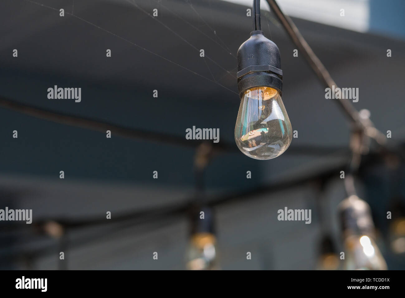 outdoor Handing light bulb string Stock Photo - Alamy