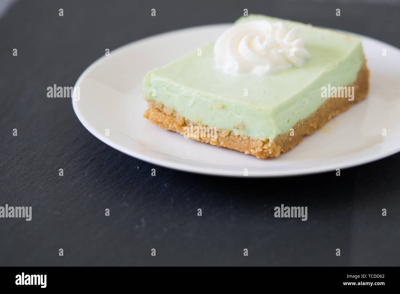 Key lime pie square slice Stock Photo - Alamy