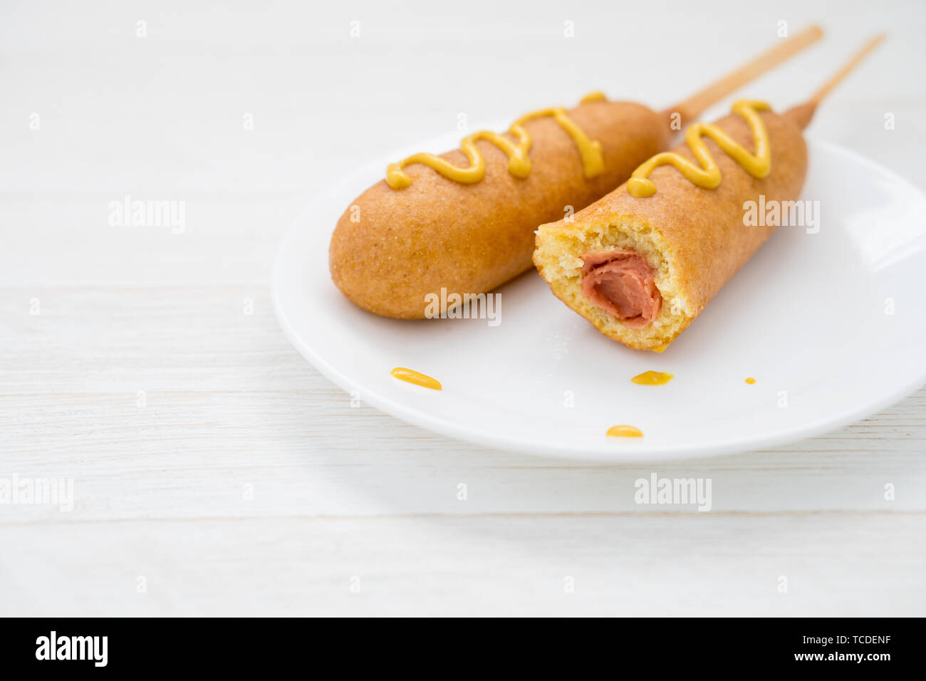 Two corn dogs mustard hi-res stock photography and images - Alamy