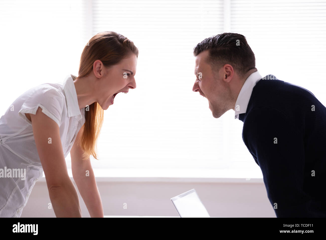 Two people screaming at each other hi-res stock photography and images - Alamy