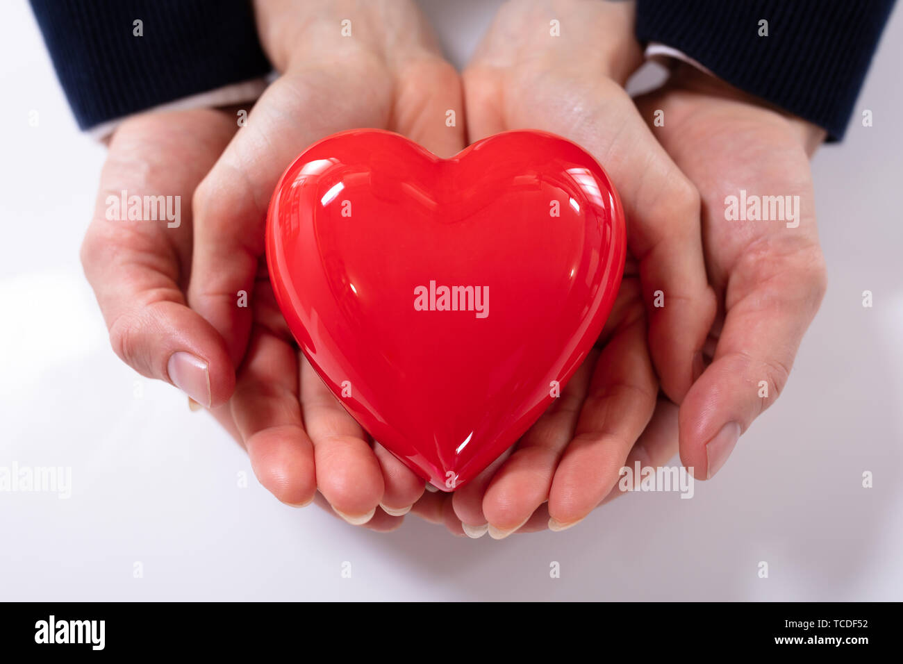 2 Hands Holding A Heart